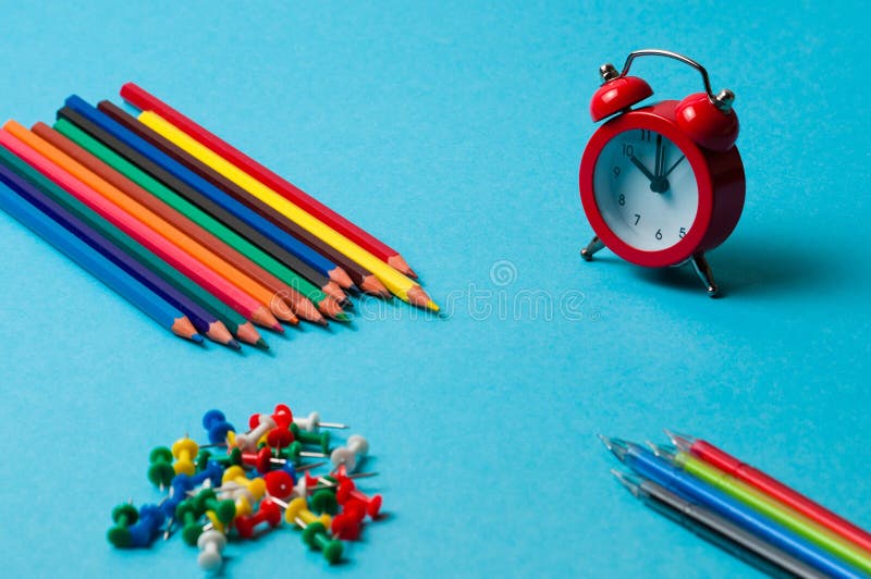 Clock, Set of Pencils, Pens and Stationery Buttons on Blue Paper for ...