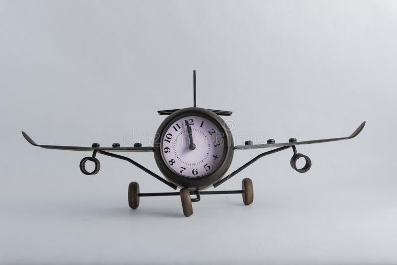 A Clock in the Shape of a Plane with Wheels Stock Image - Image of ...