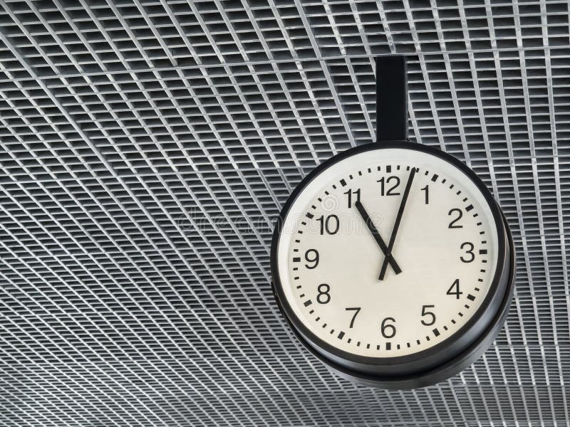 Wall Clock Displaying 12 O Clock in a Modern Indoor Space with a Grid ...