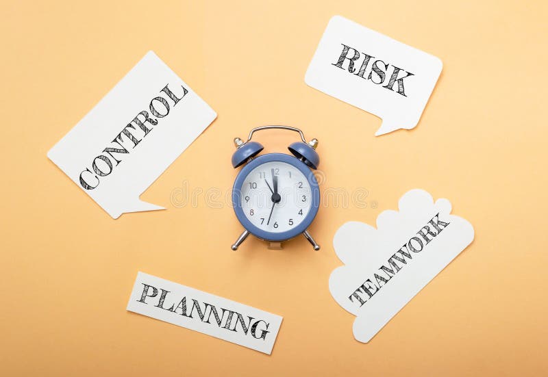A Clock Sits on a Table with a Bunch of Paper Words Around it Stock ...