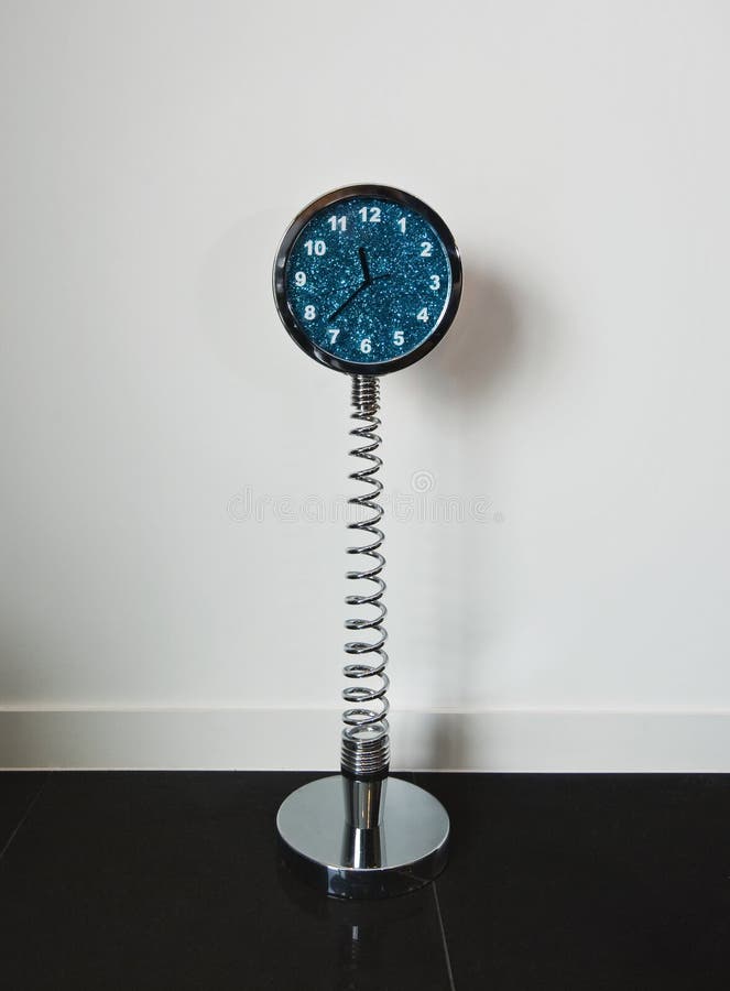 Clock on spring stand stock image. Image of blue, point - 13591383