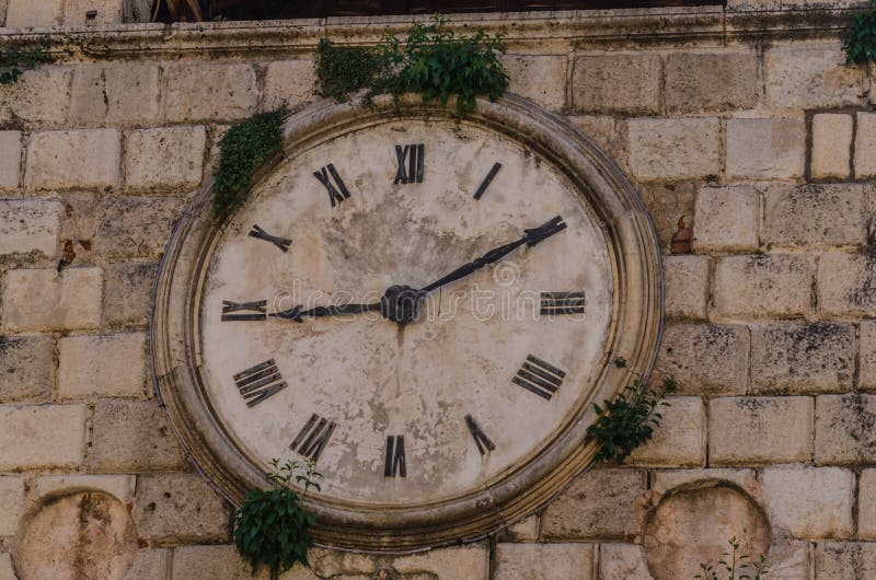 Clock in a stone wall stock image. Image of europe, church - 107255543