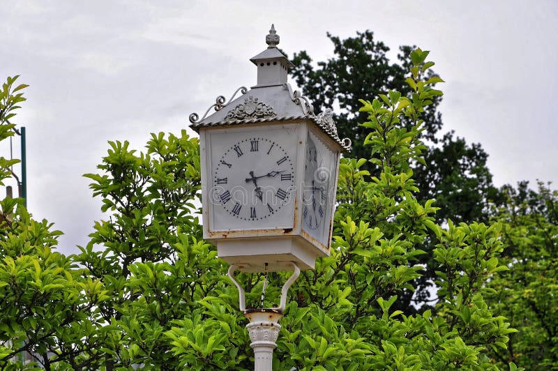 Clock in the street lamp stock photo. Image of rock, beautiful - 91971924