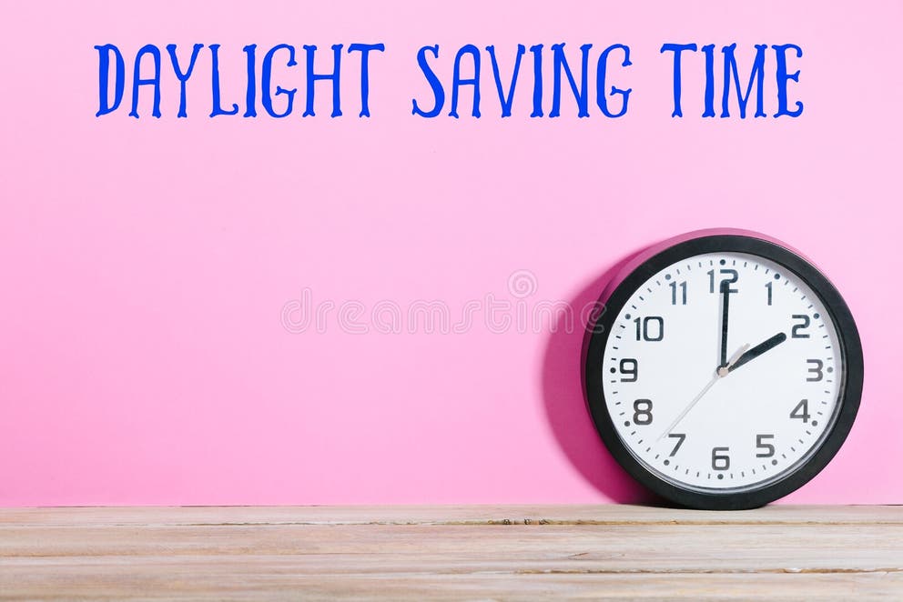 Clock on Table with Daylight Saving Time Message Stock Photo - Image of ...
