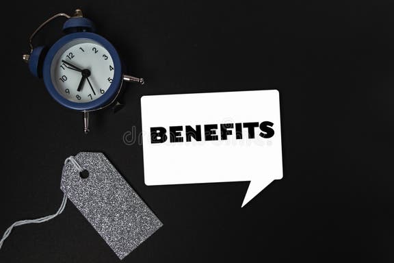 Clock is on a Table with a Tag that Says Benefits Stock Image - Image ...