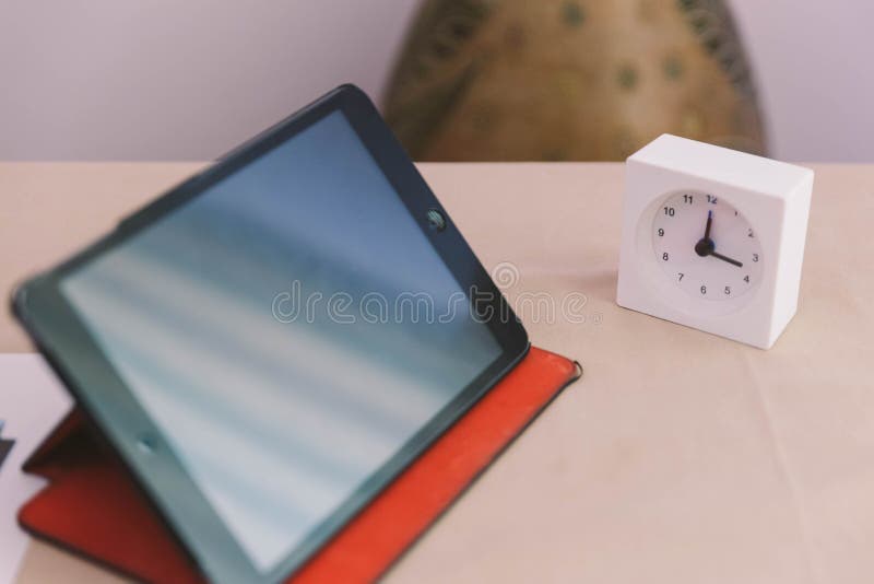Clock and Tablet on the Wooden Table Stock Image - Image of game, blue ...