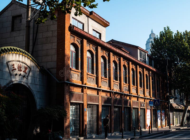 A Building with a Large Clock on the Front and Side of it Editorial ...