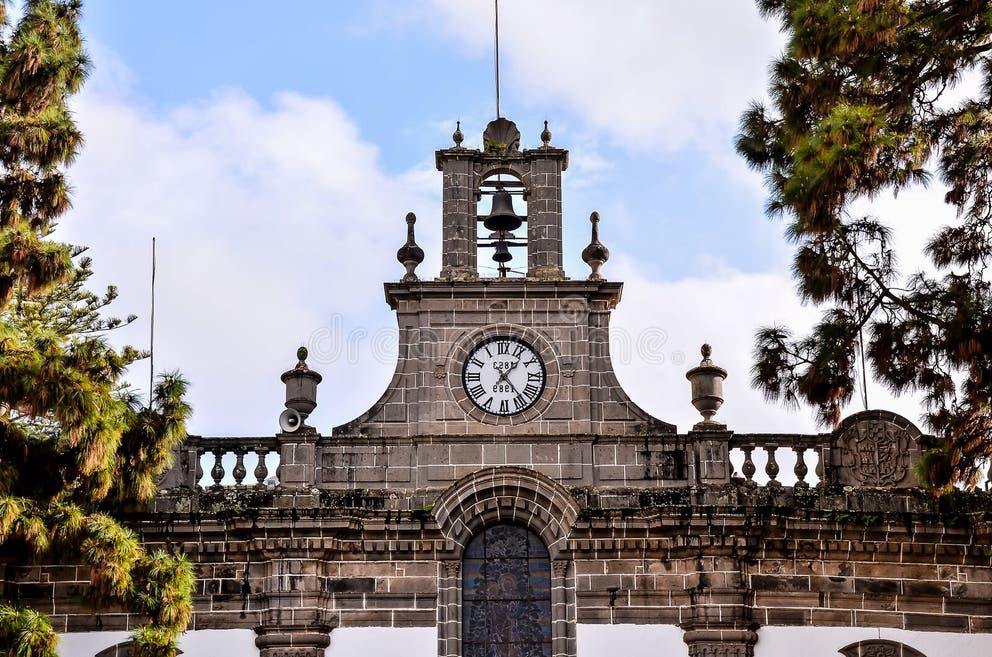 A Clock Tower with a Large Clock Face and a Bell Stock Photo - Image of ...