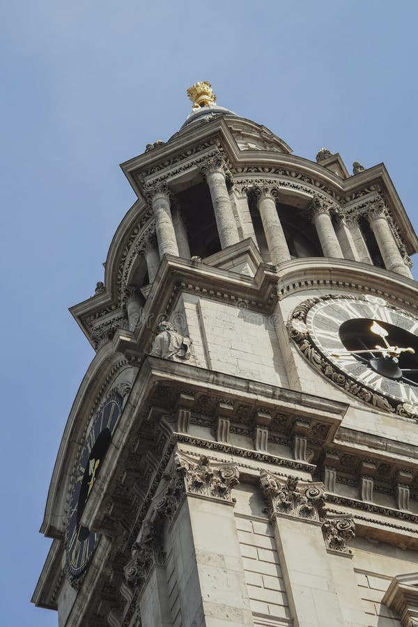 Clock Tower with Multiple Clocks with a Golden Statue on Top, Viewed ...