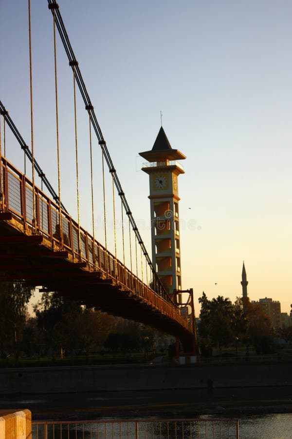 Clock tower next to bridge stock photo. Image of river - 201294096