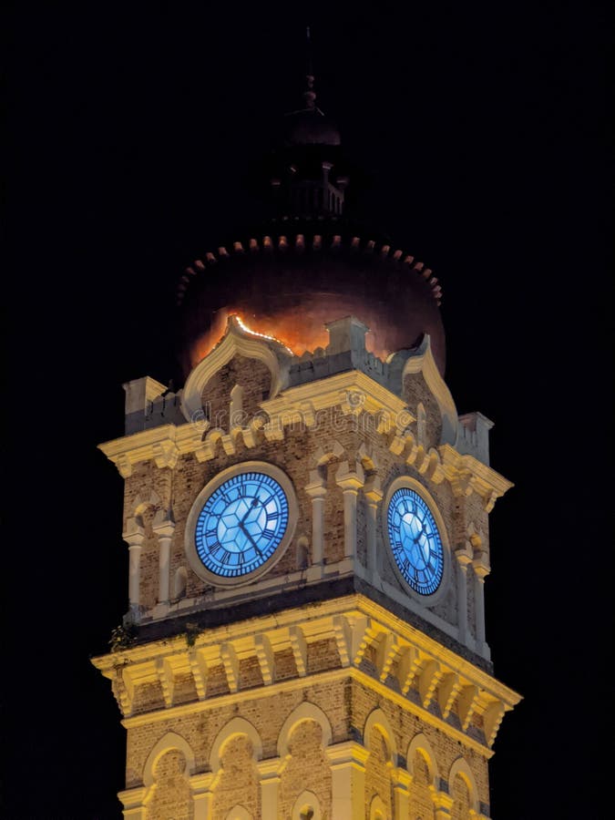 A Clock Tower at Night. Dark Background and Hd Wallpaper Stock Image ...