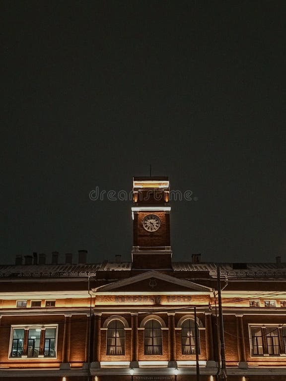 The Clock Tower at Night Glows Beautifully in the Rays of Lanterns ...