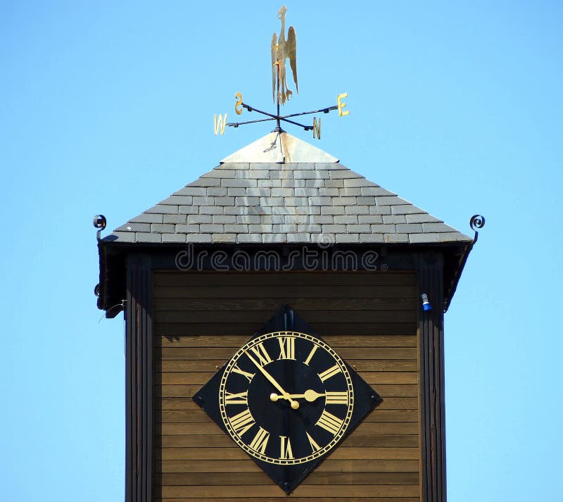 Clock tower with wind vane stock photo. Image of white - 54084808