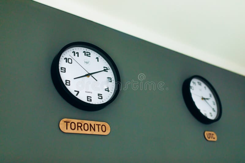The Clock on the Wall in the Hotel Stock Photo - Image of desk ...