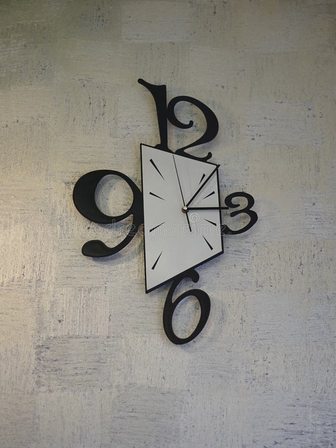 Clock on the Wall with Numbers 3, 6, 9 and 12 and Clock Hands Stock ...