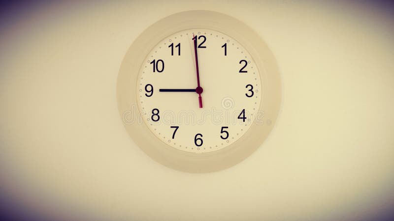 Clock on Wall Showing Nine Hours Stock Image - Image of hours, white ...