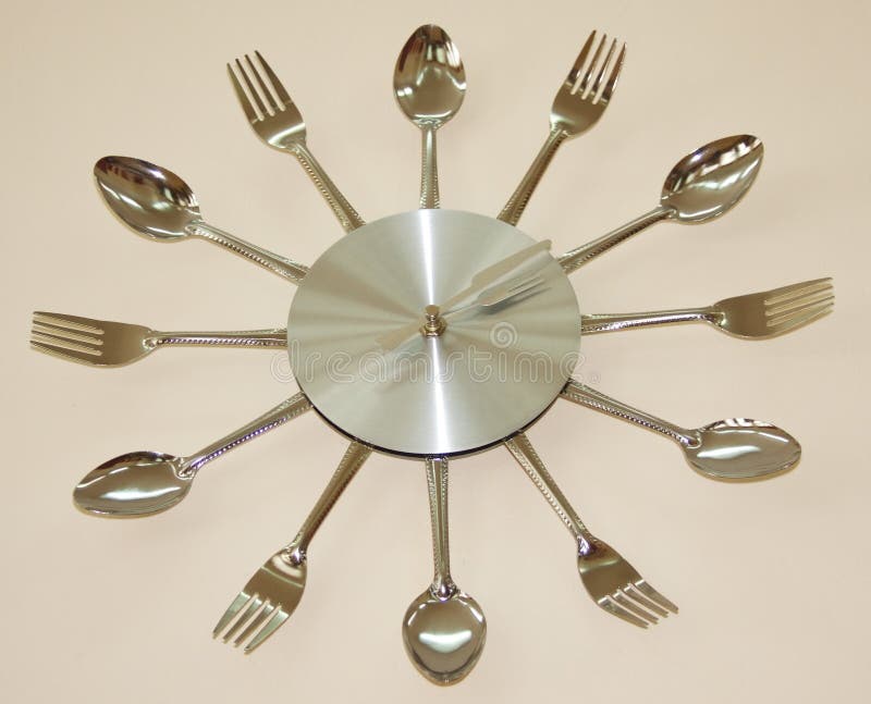 Clock on a Wall from Spoons and Forks Stock Photo - Image of beautiful ...