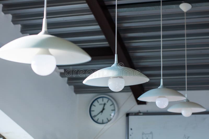 A Clock, Which is Hanging from the Ceiling, Displays the Time As 420 ...