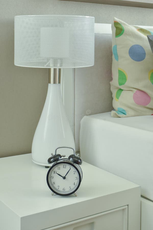 Clock and White Lamp on Bedside Table in Living Room Stock Photo ...