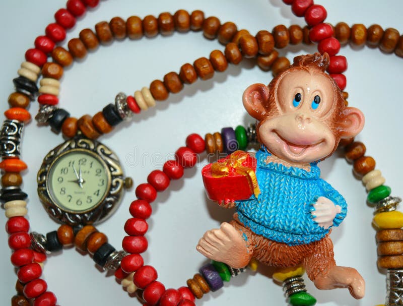Clock with Wooden Beads and Decorative Monkey Stock Image - Image of ...
