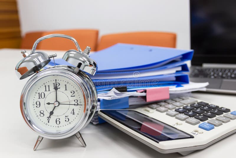Clock on Work Desk with Calculation, Docutment in the Work Office Time ...
