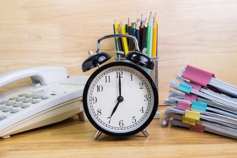 7 am Clock on Work Desk in the Office Time of Business Working Concepts ...