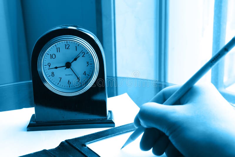 Clock and Writing Hand on Note Stock Image - Image of financial ...