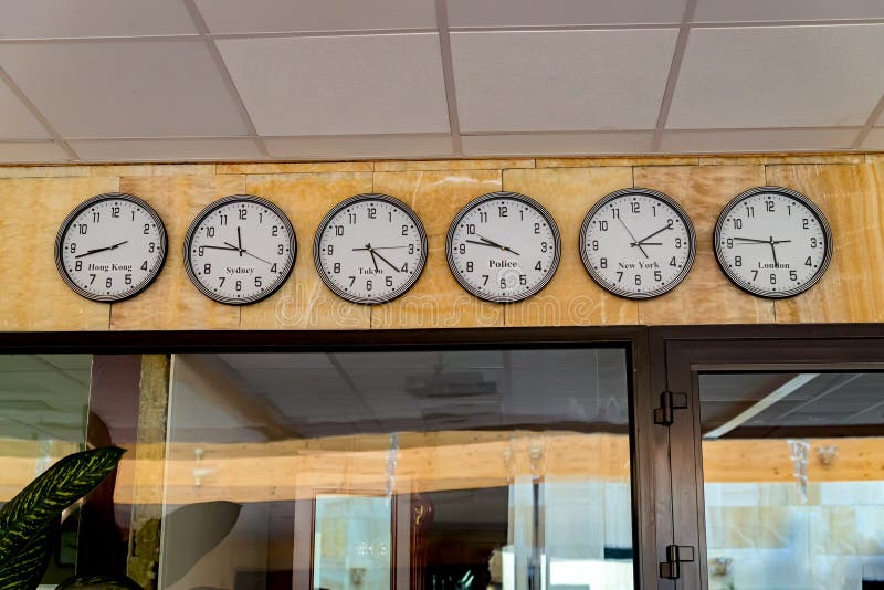 12 Clocks Showing Different Time Stock Photo - Image of face, number ...