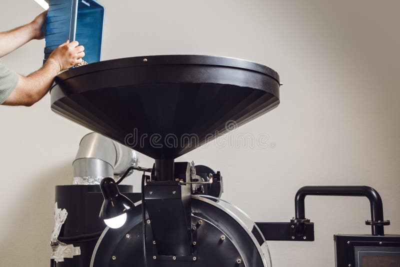 Close-up of Worker Pouring Coffee Beans into Roaster during Roasting ...