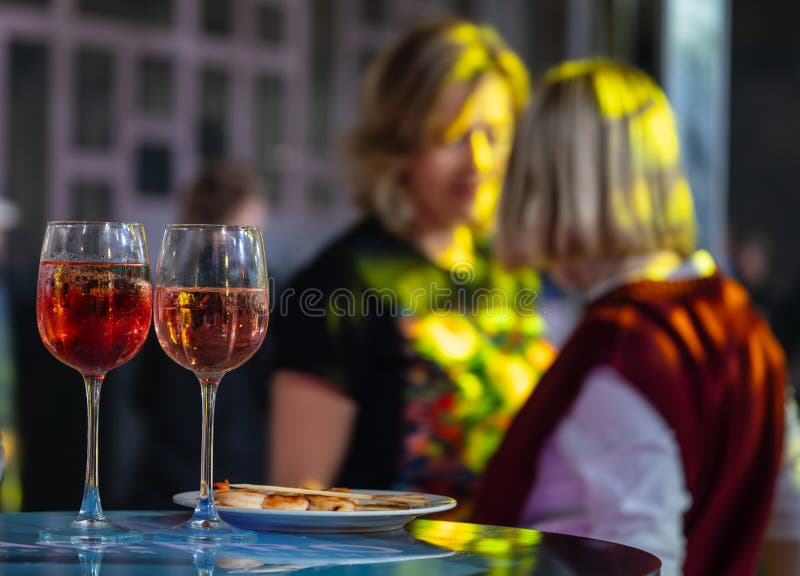 Close Friends Enjoying an Evening with Drinks and Conversation Stock ...