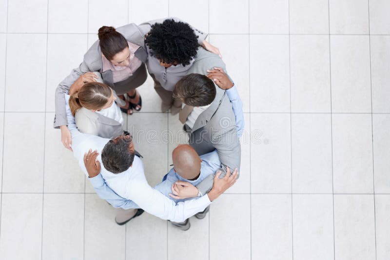 Close Huddle for a Strategy Talk. Top View of a Business Team in a ...