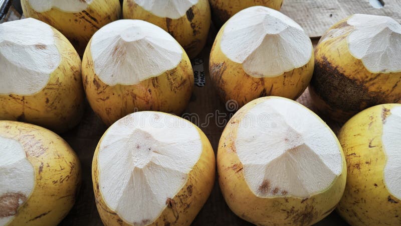 A Few Partially Husked Coconut on Display. Stock Photo - Image of husk ...