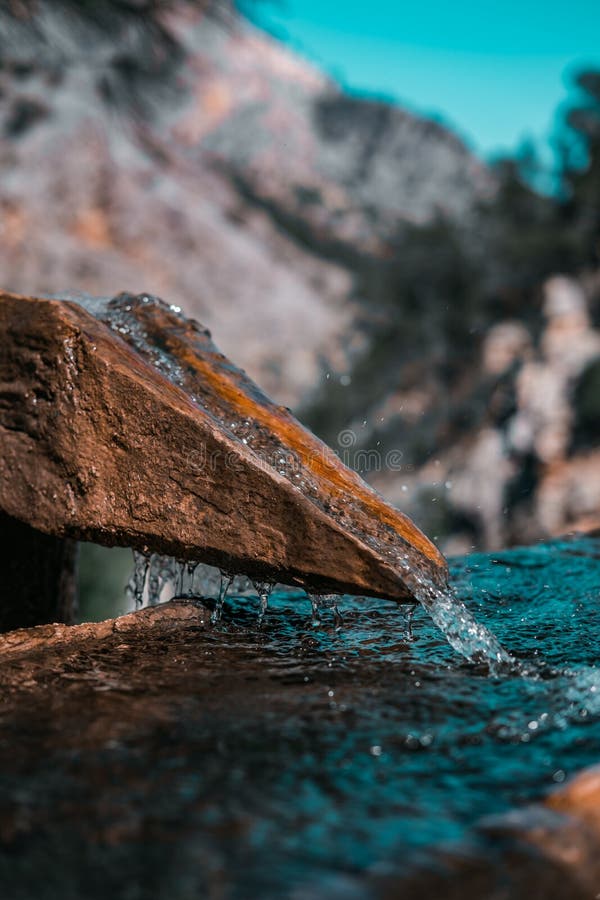Close Image of a Spring Water Pouring Down from Small Stone Channel ...