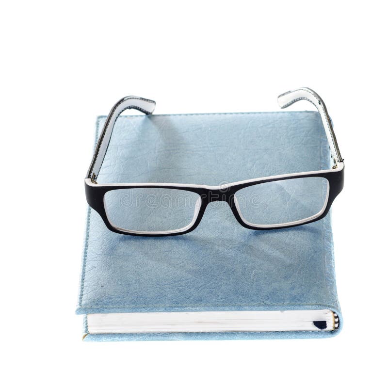 Close Notebook and Glasses Isolated on White. Stock Photo - Image of ...