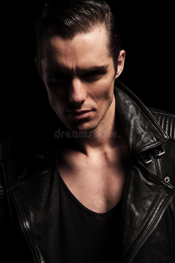 Close Portrait of Rocker in Leather Jacket Posing in Dark Stock Photo ...