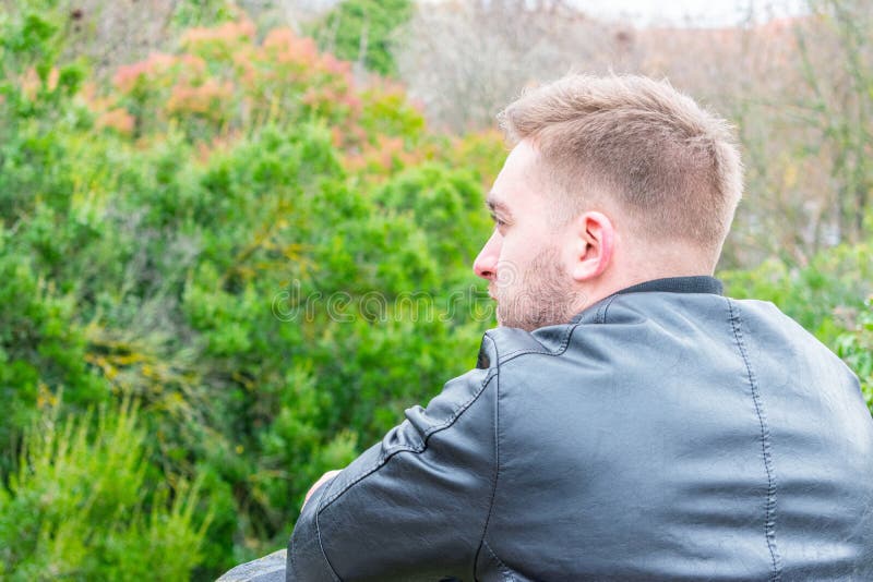 Close Portrait of Young Man from Behind in a Park Stock Photo - Image ...