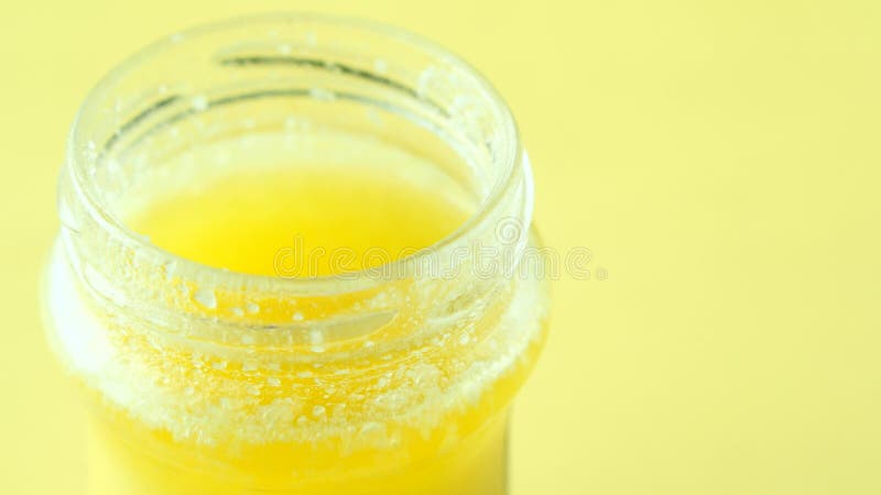 Close Pu of Homemade Ghee in Container on Yellow Background Stock Video ...