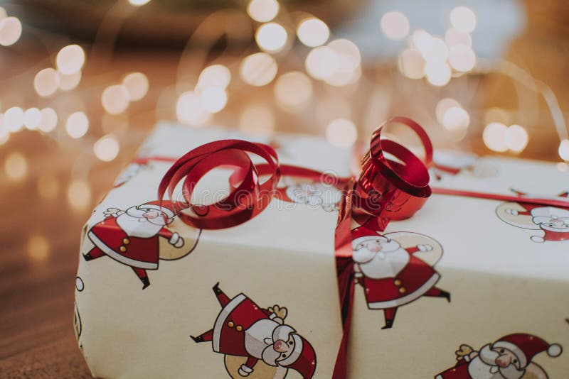 Close Range Shot of Wraped Up Present with Blurred Lights in the ...