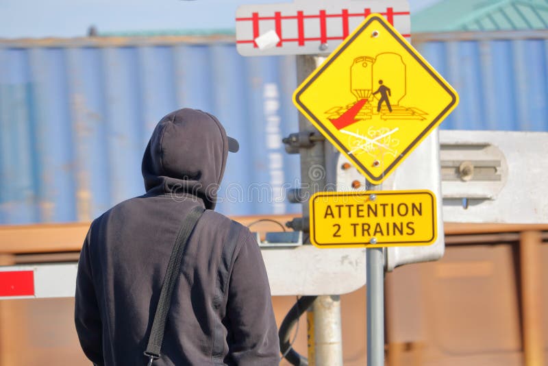 Train Crossing Warning Sign and Person Stock Image - Image of close ...