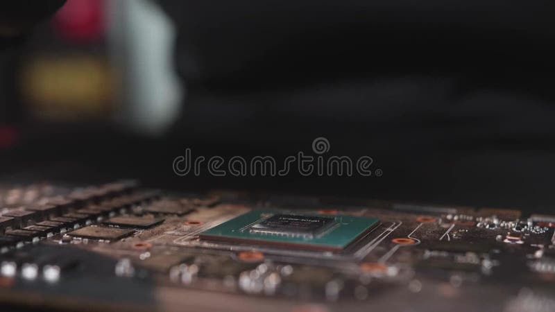 Repairer of Electronics Uses a Napkin To Remove a Thermal Grease from a ...