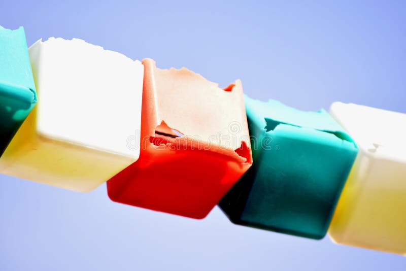 Close Shot of Different Colored Cubes on a Rope with a Clear Sky in the ...