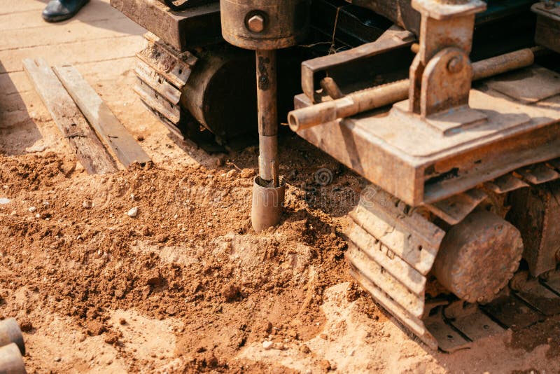 Close Shot of a Heavy Machine Digging the Ground at Daytime Stock Photo ...