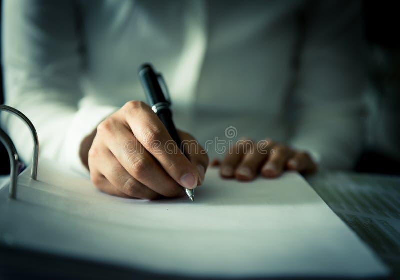 Close Shot of a Human Hand Writing Something on the Paper Stock Photo ...
