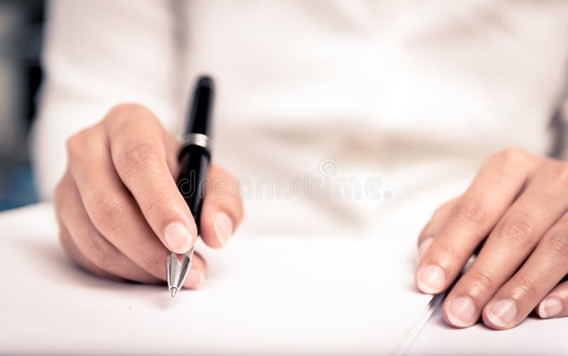 Close Shot of a Human Hand Writing Something on the Paper Stock Photo ...