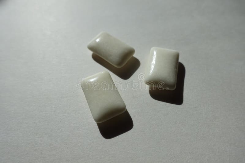 Close Shot of Three White Pieces of Chewing Gum Stock Photo - Image of ...