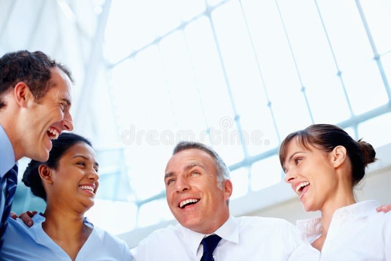 Close Team of Executives Laughing. Low Angle View of Team of Executives ...