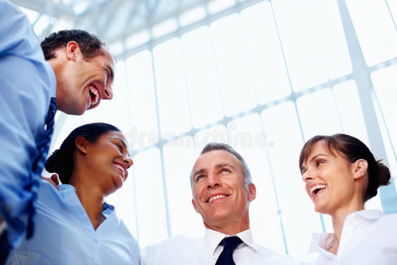 Close Team of Executives Smiling. Low Angle View of Team of Executives ...