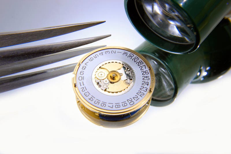 Close Uo of a Watch Movement with Tweezers and a Magnifying Monocle ...