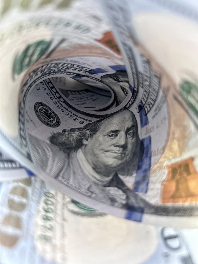 Close-up Abstract Image of a Rolled US 100 Dollar Bill, Featuring a ...