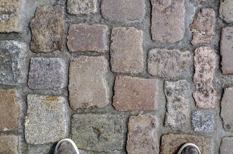 Close Up View of Cobblestone Pavement with Toe-caps Stock Image - Image ...